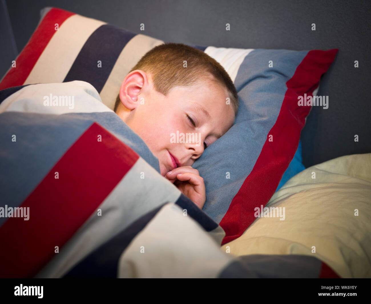 Young Boy sleeping in his bed Stock Photo - Alamy