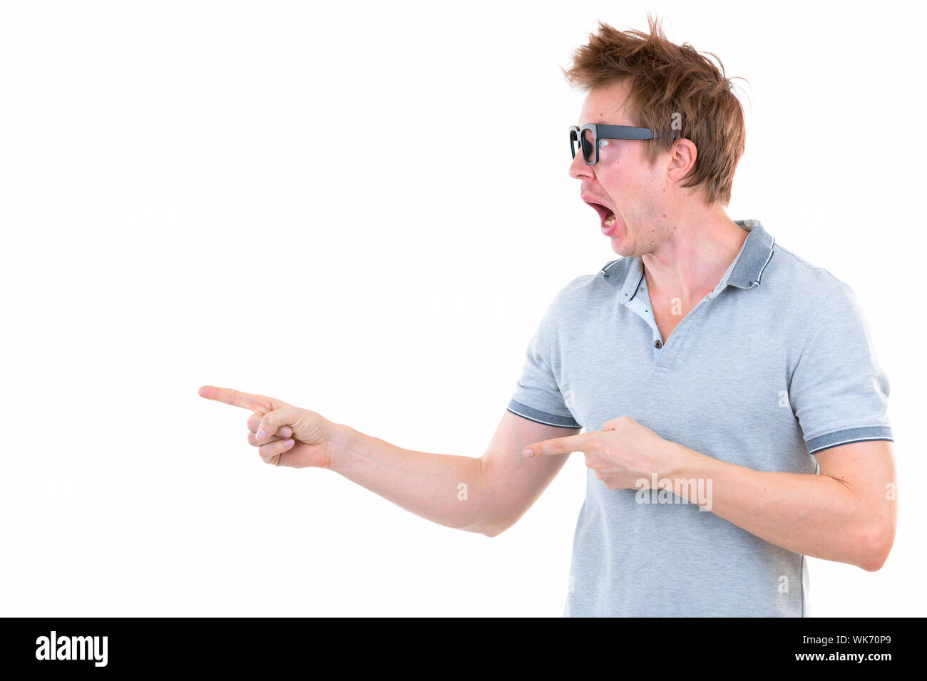 Funny young nerd man with big eyeglasses pointing finger and showing ...