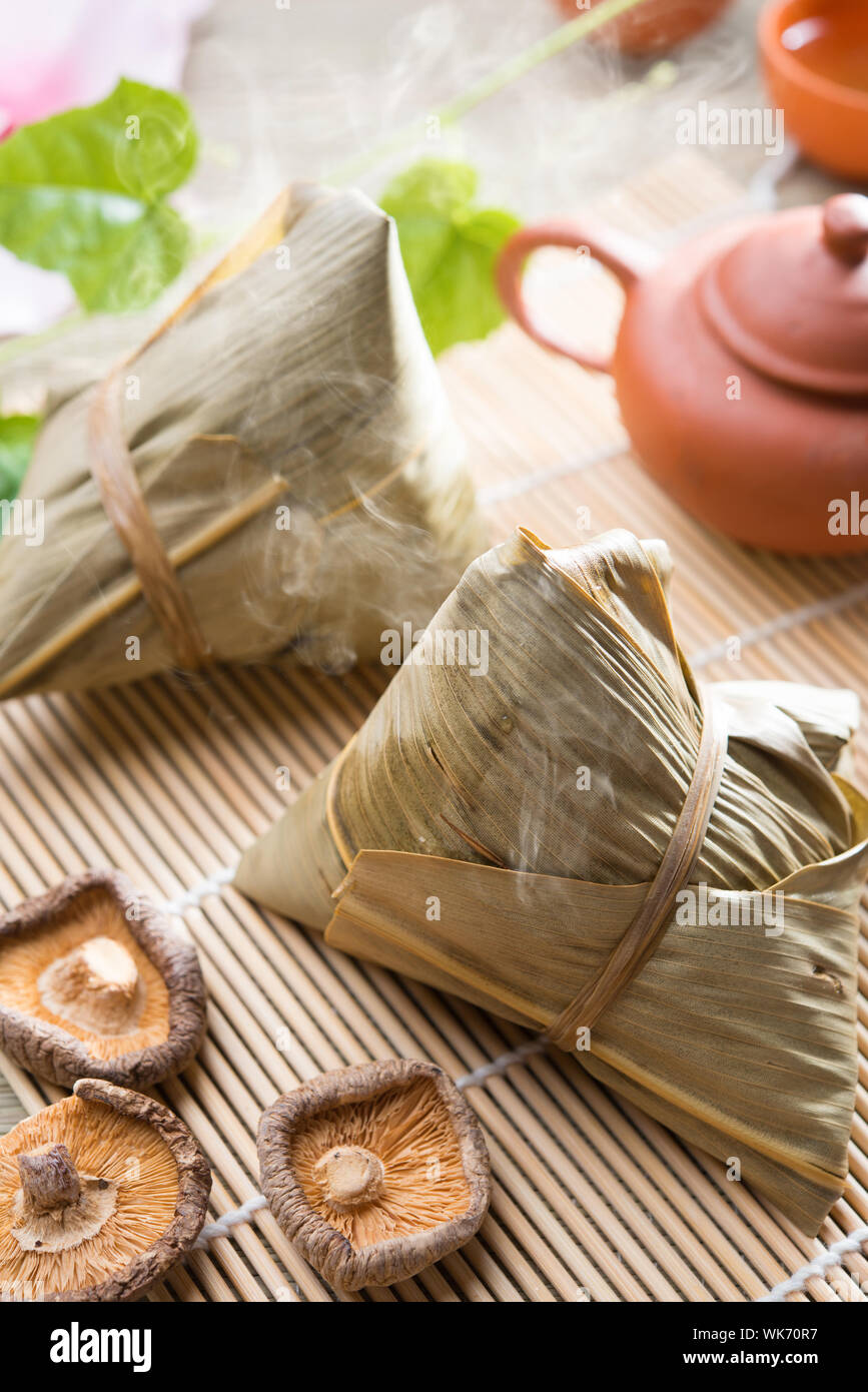 Traditional steamed sticky glutinous rice dumplings. Hot rice dumpling ...