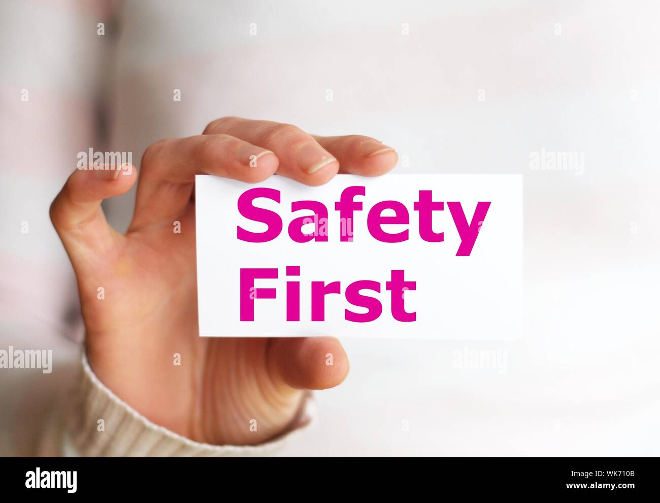 safety first concept with hand word and paper Stock Photo - Alamy