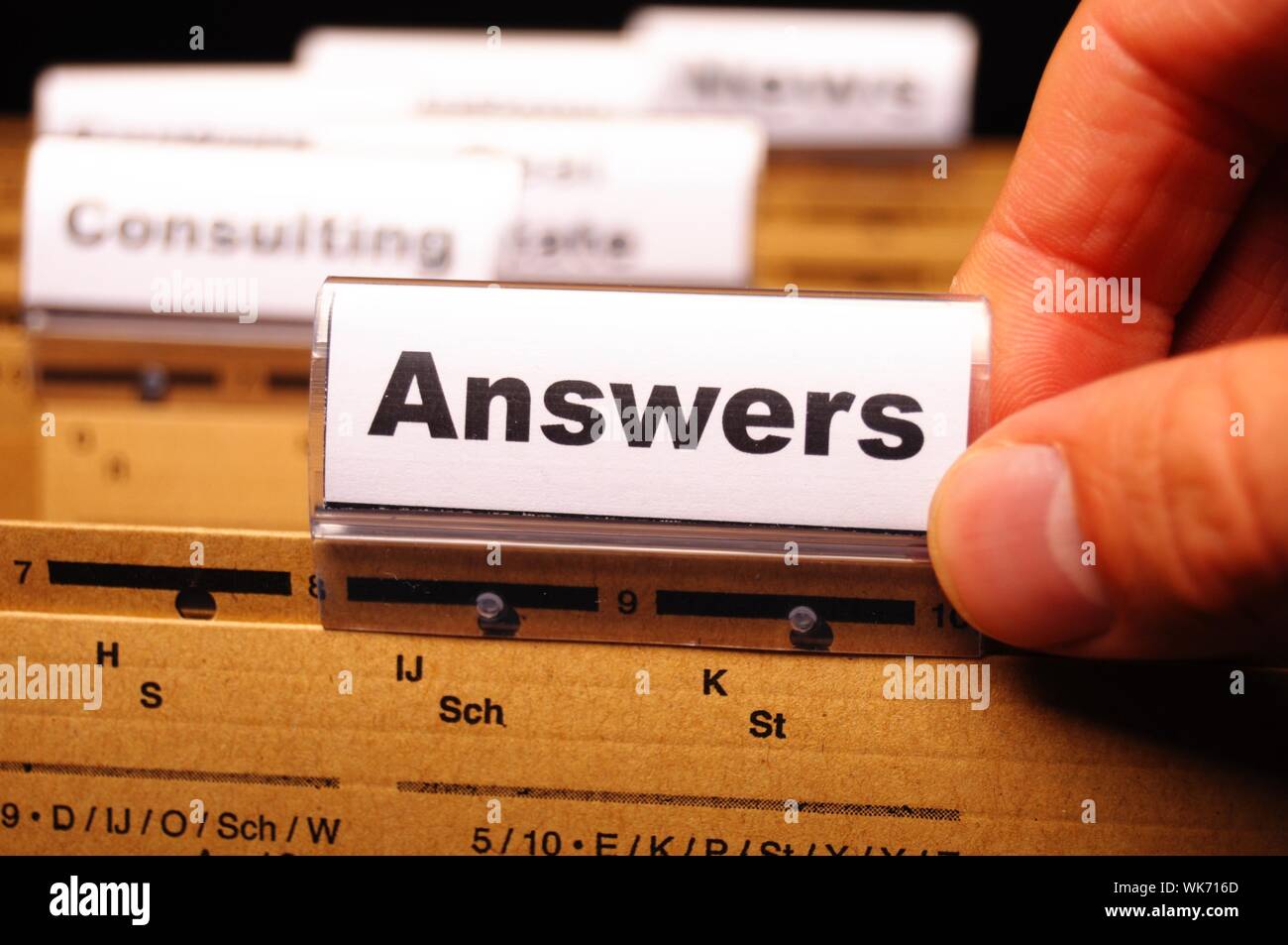 answers word on register or hanging folder showing solution concept ...