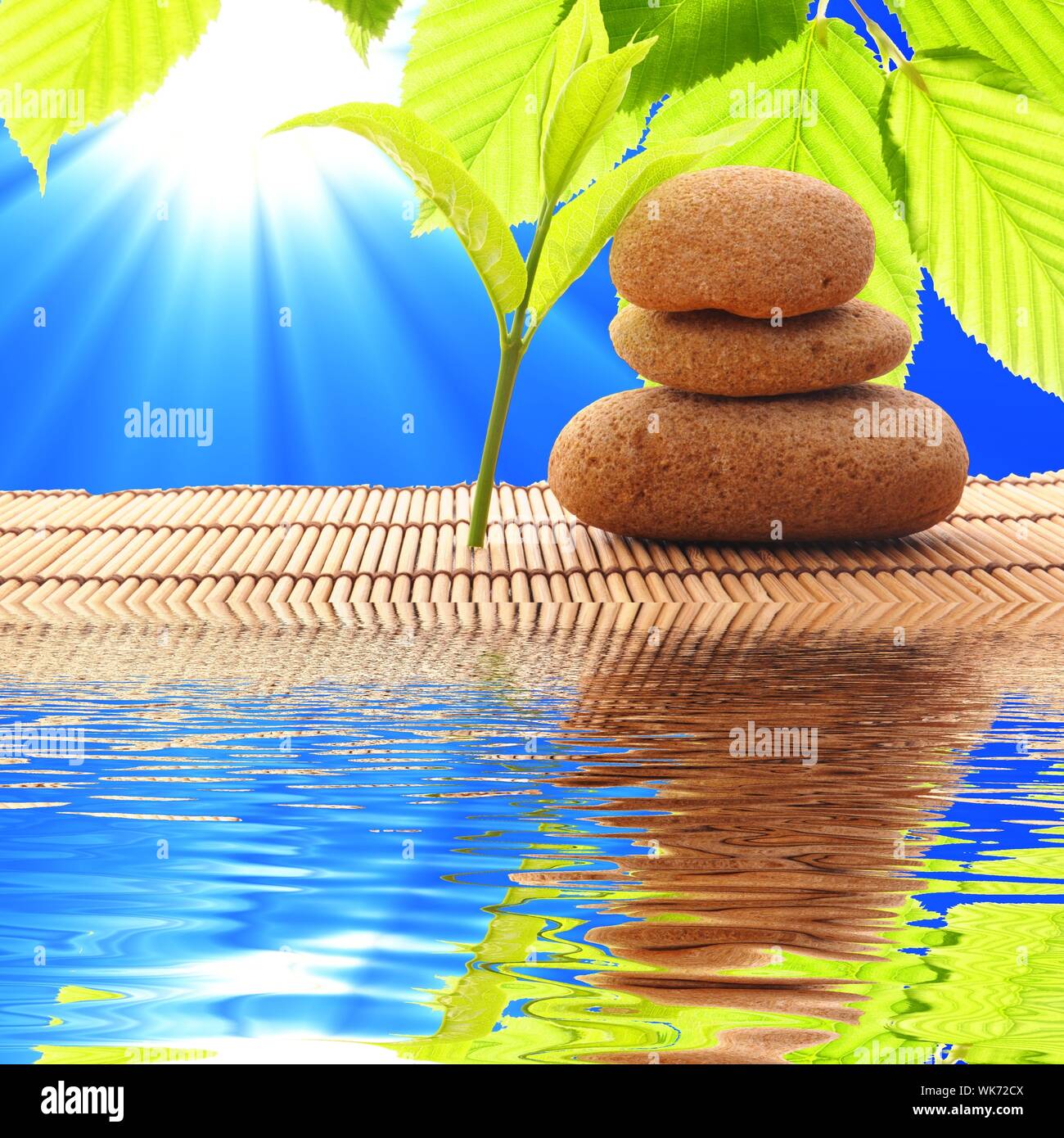 zen stones and water reflection showing spa concept Stock Photo - Alamy