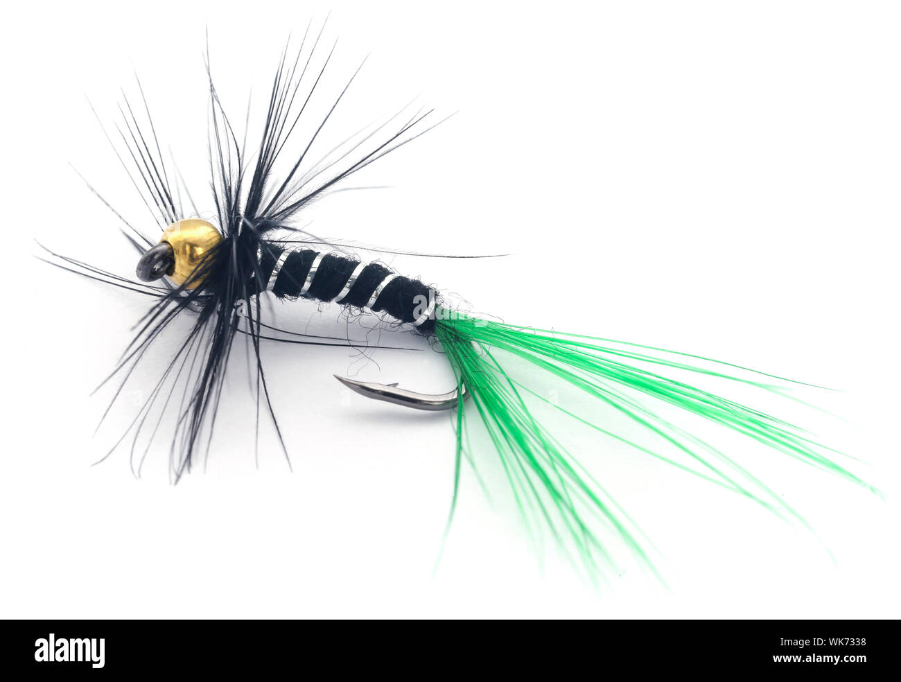 Fishing fly with hook over white background Stock Photo - Alamy