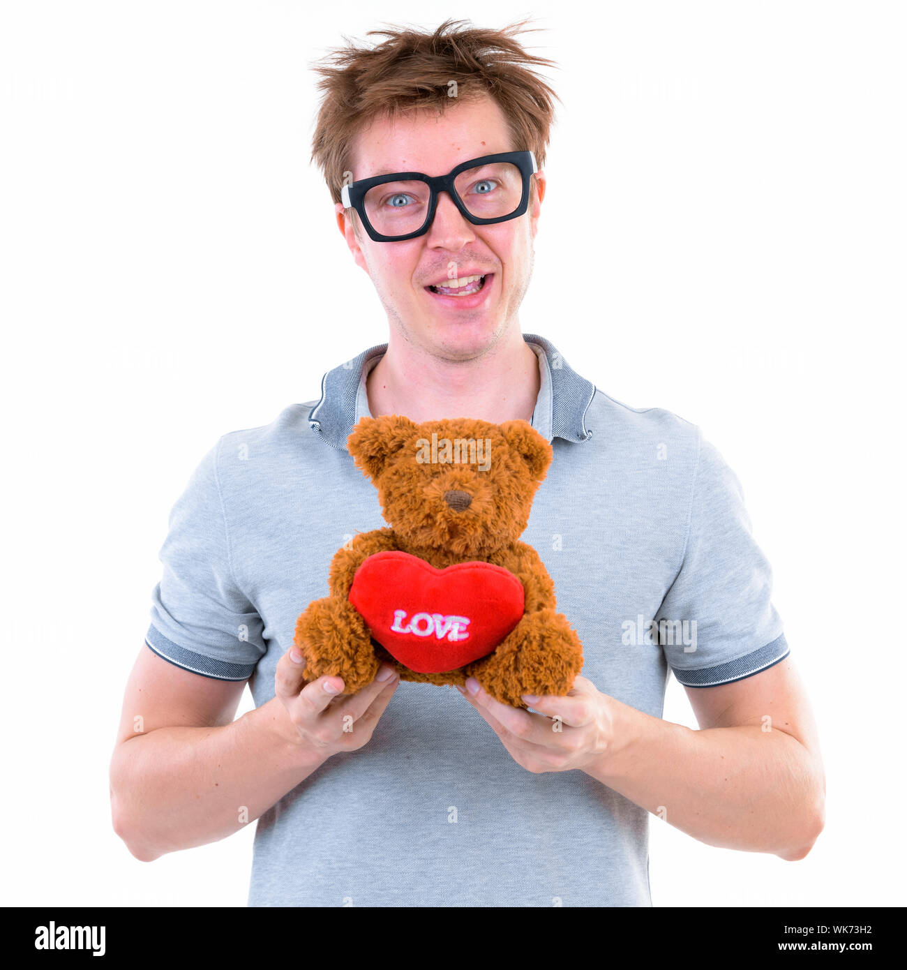 Funny young nerd man with big eyeglasses holding teddy bear Stock Photo ...
