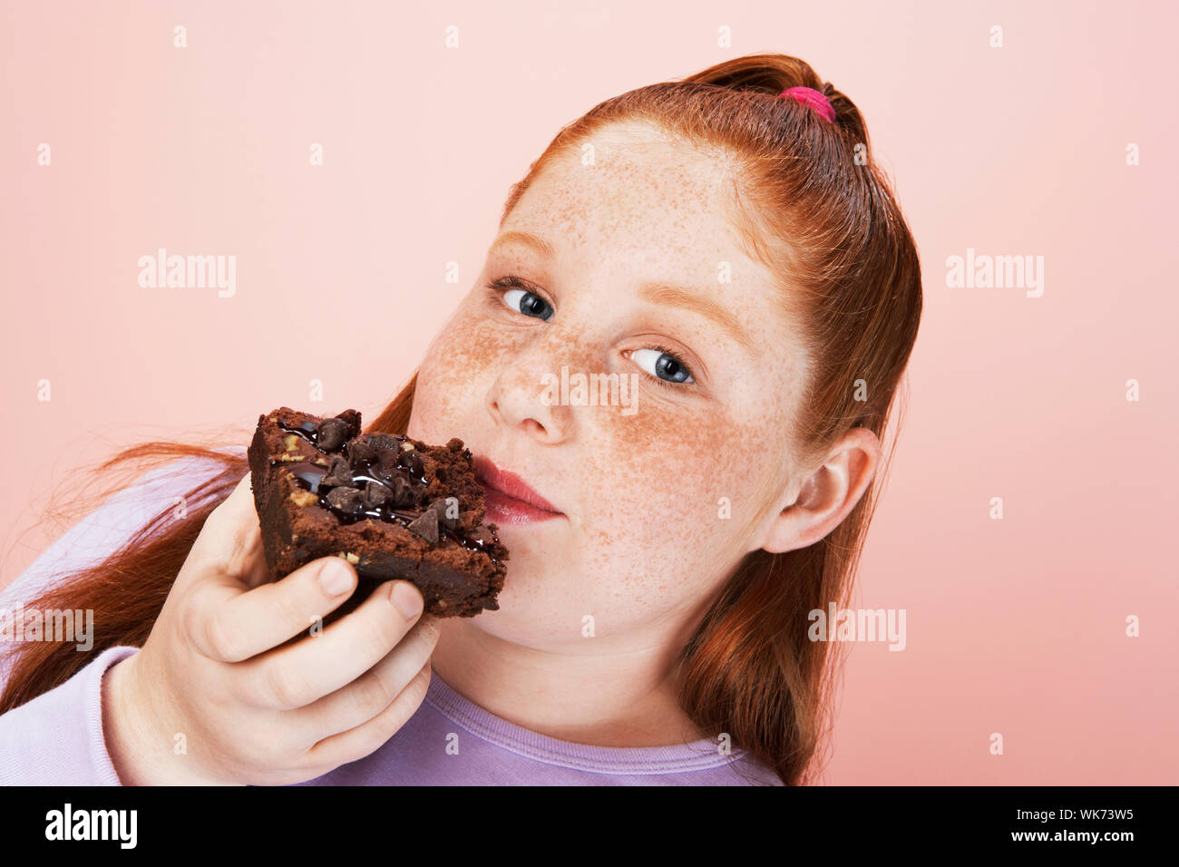 Overweight Child Eating Junk Food Stock Photo - Alamy