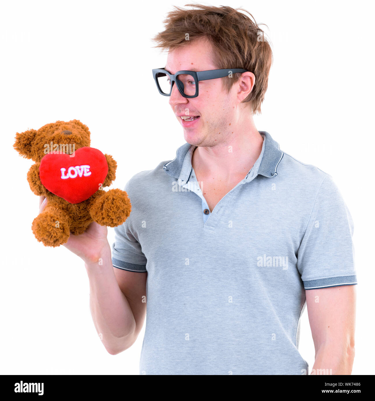Funny young nerd man with big eyeglasses holding teddy bear Stock Photo ...
