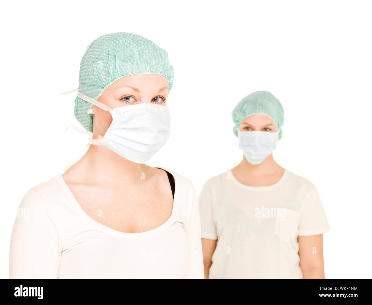 Two Female nurses isolated on white background Stock Photo - Alamy