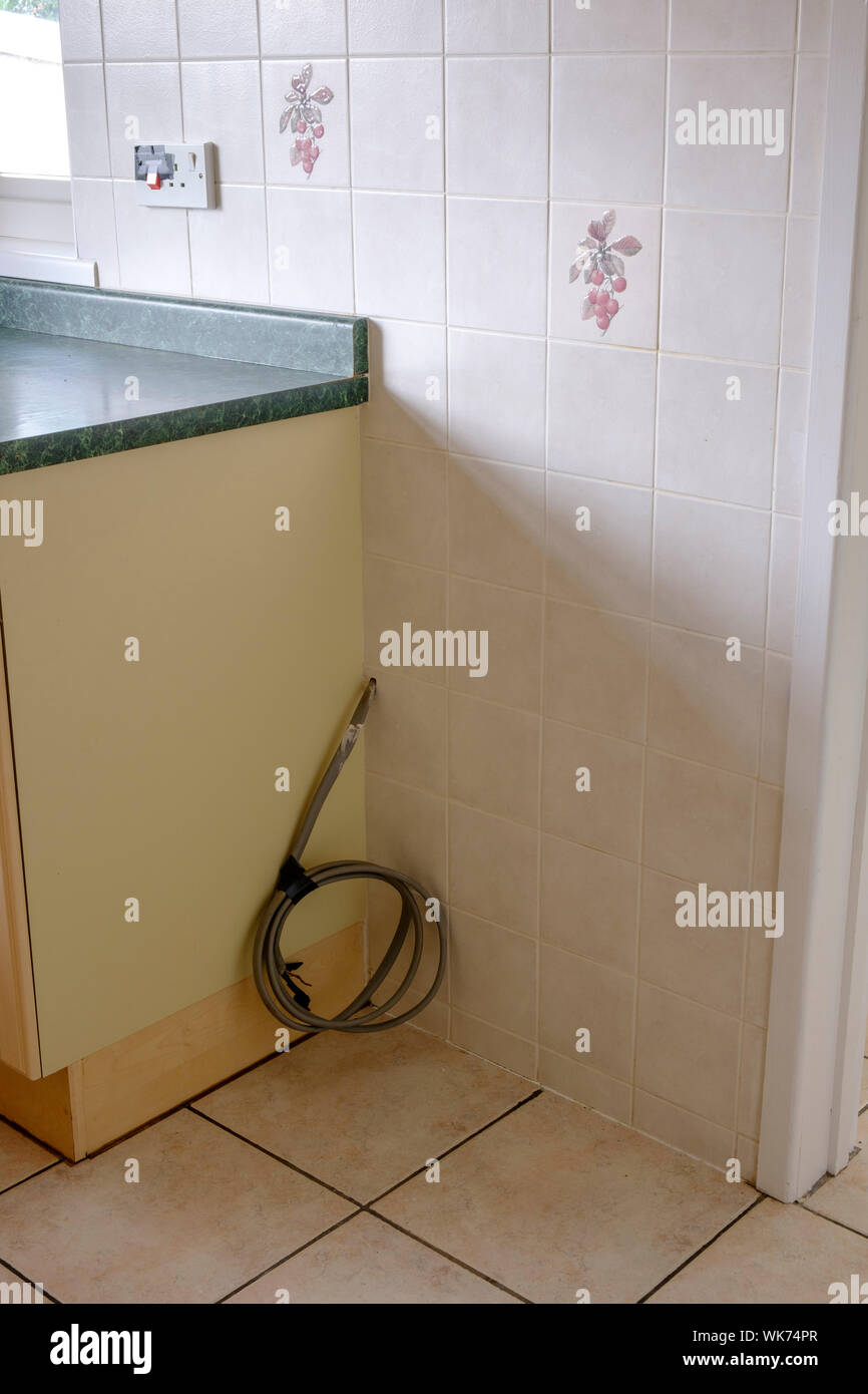 Empty room kitchen cooker cable coming out of wall Stock Photo - Alamy