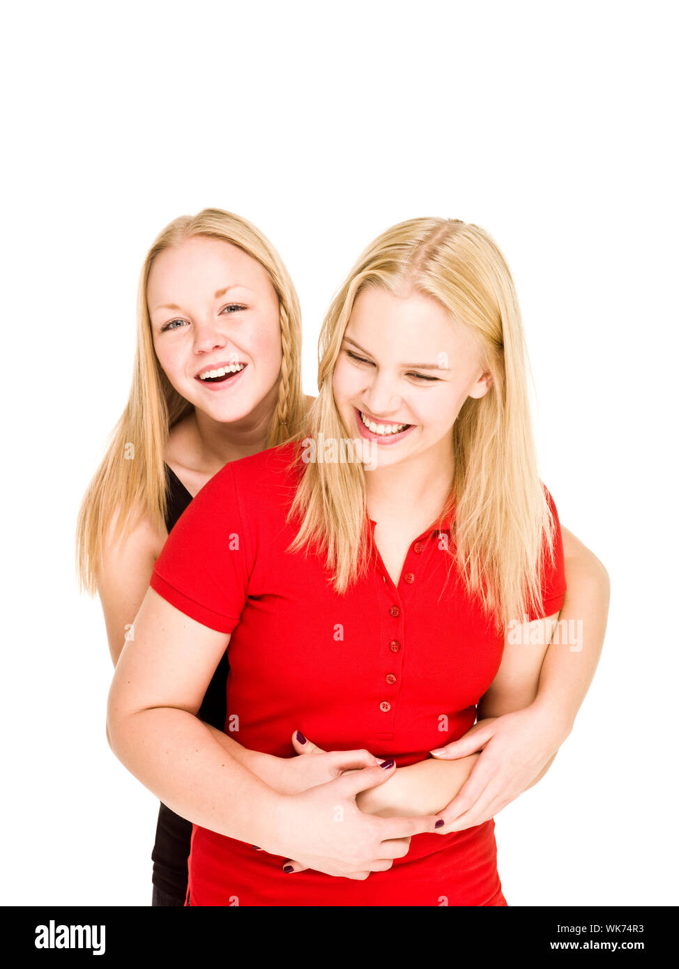 Two bonding Girls isolated on white background Stock Photo - Alamy