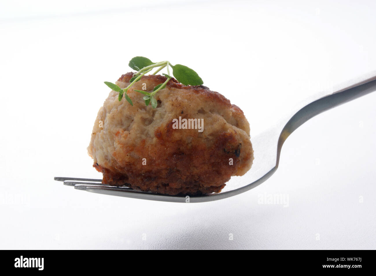 one grilled mince ball on a fork Stock Photo - Alamy