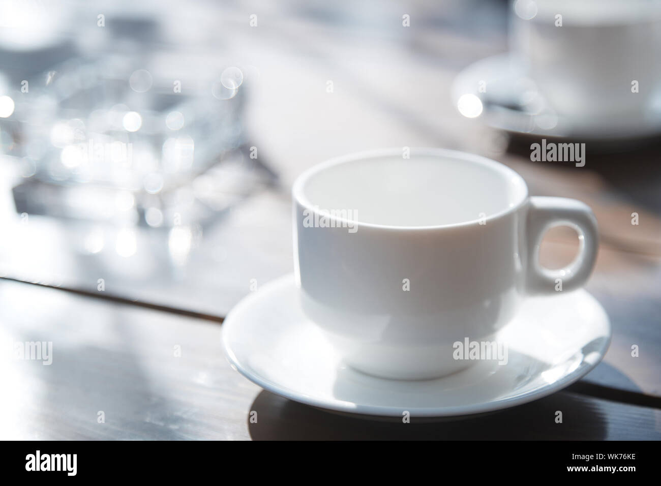 Teacup on the table at outdoors cafe Stock Photo - Alamy