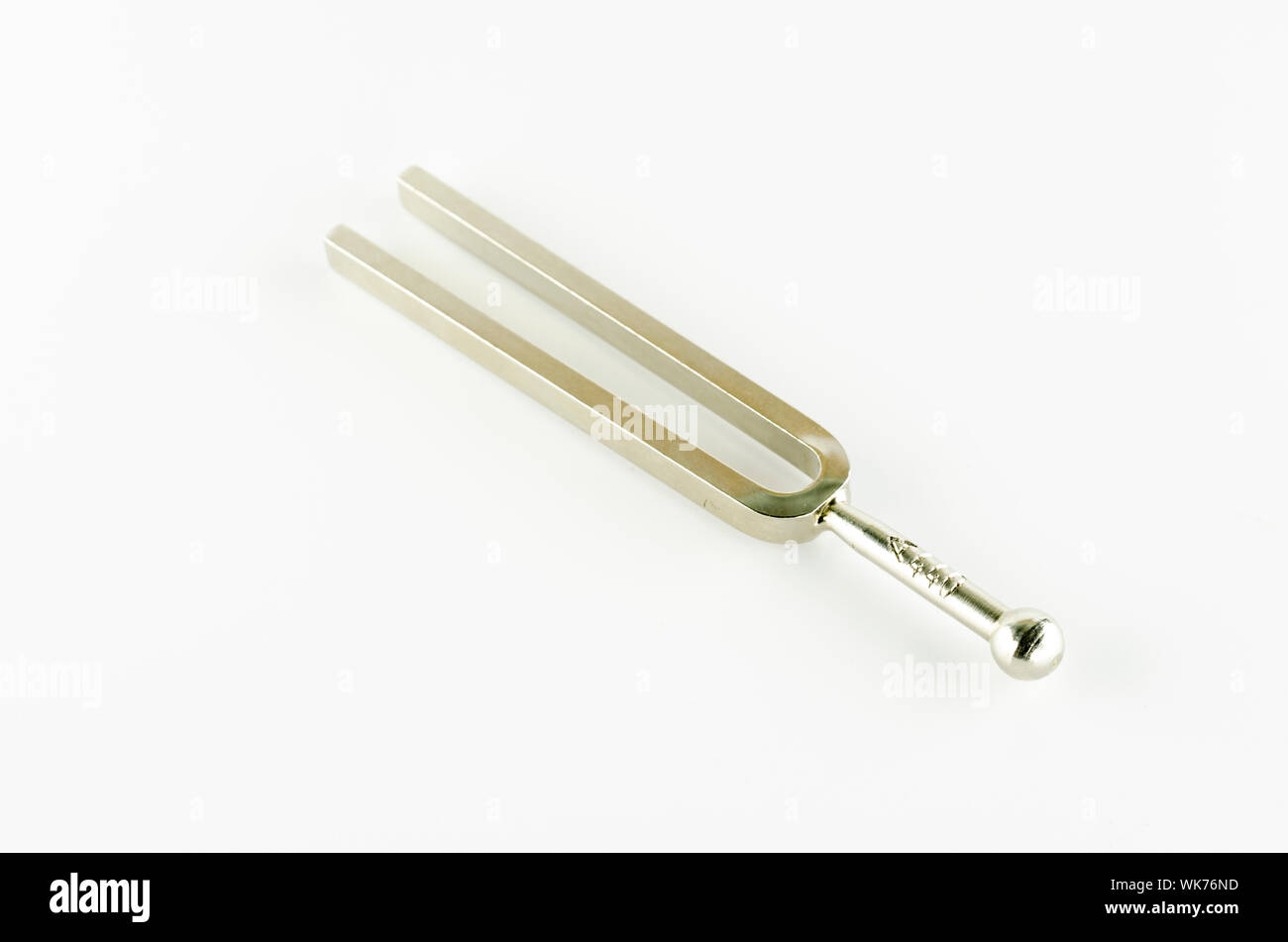 music tools tuning fork on a white background Stock Photo - Alamy