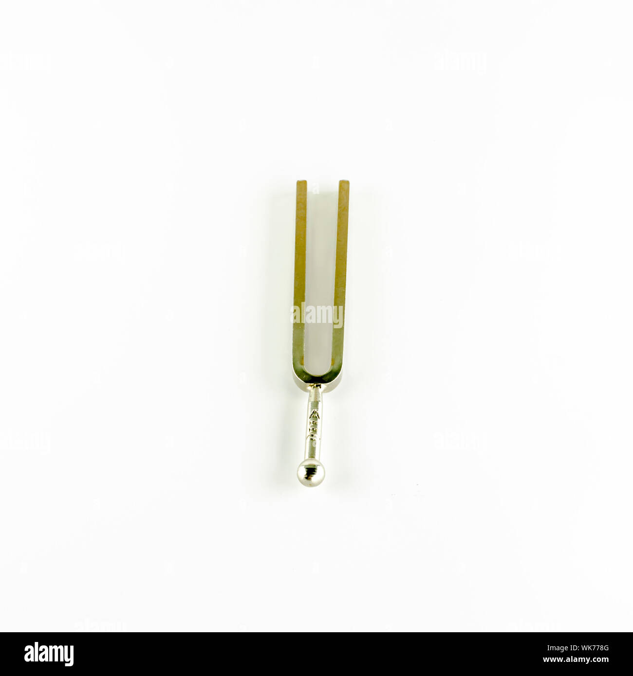 music tools tuning fork on a white background Stock Photo - Alamy