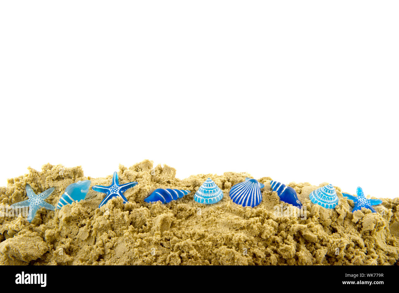Beach with blue shells in the sand Stock Photo - Alamy