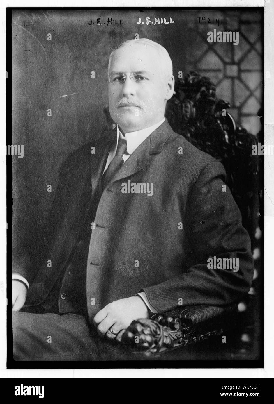 J.F. Hill, seated Stock Photo - Alamy