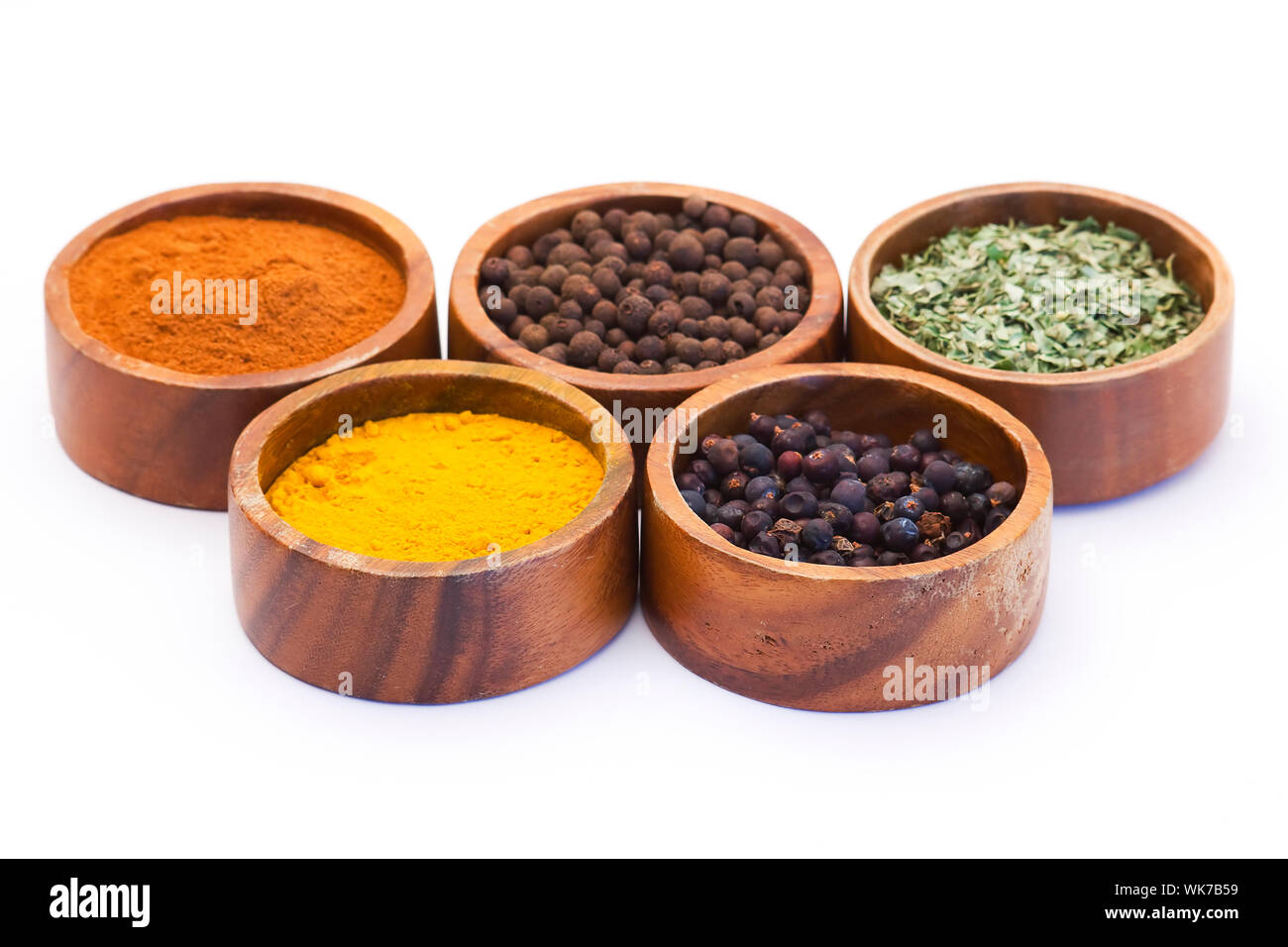 five bowls of spices isolated on white Stock Photo - Alamy