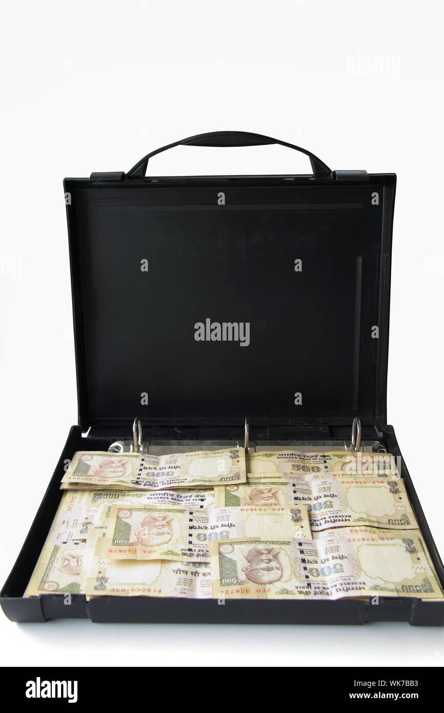 Briefcase full of money Stock Photo - Alamy