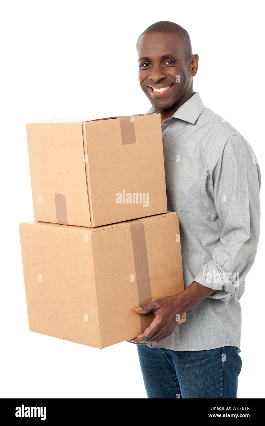 African man handing pile of cardboard boxes Stock Photo - Alamy