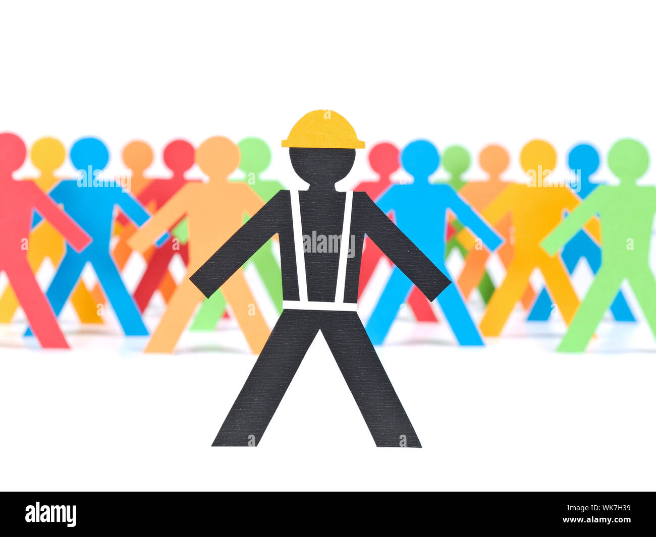 A paper construction worker stands out from the multicolored crowd ...