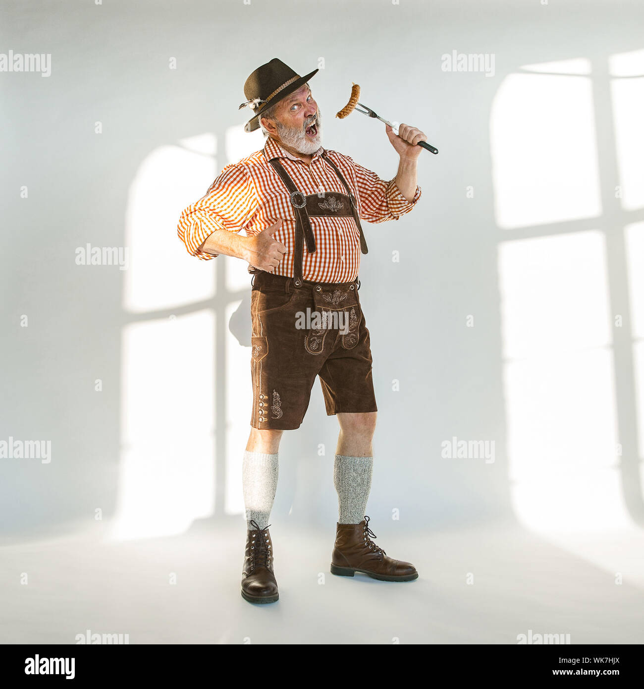 Portrait of Oktoberfest senior man in hat, wearing the traditional ...
