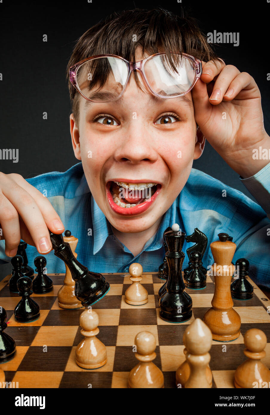 Wunderkind play chess. Funny Nerd boy Stock Photo - Alamy