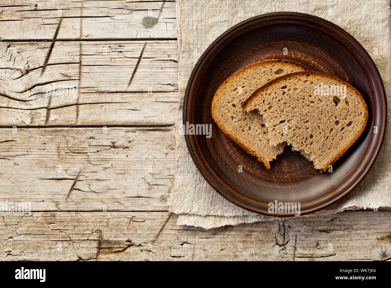 rye bread in a plate on rustic wooden background Stock Photo - Alamy