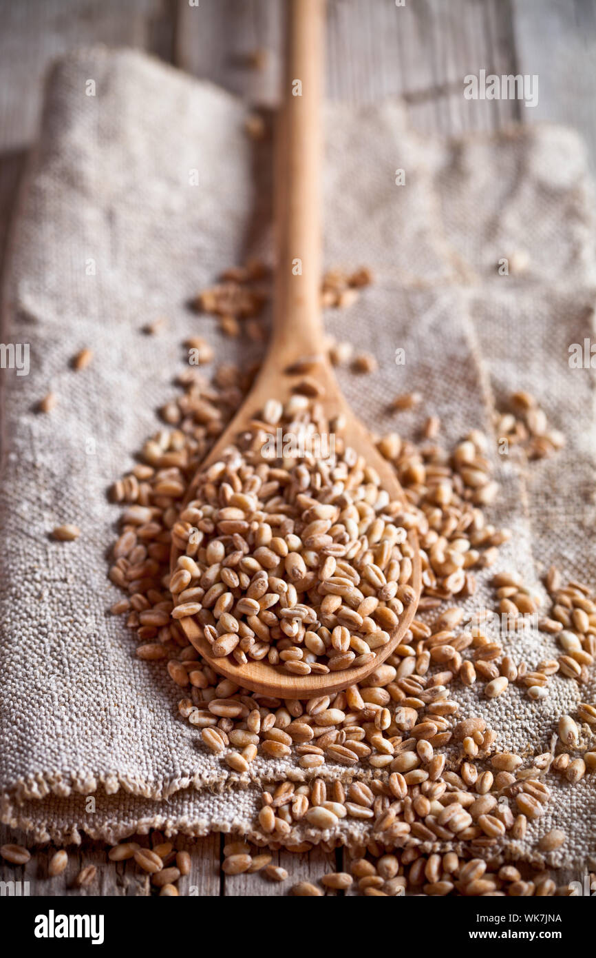 wheat grain in wooden spoon Stock Photo - Alamy