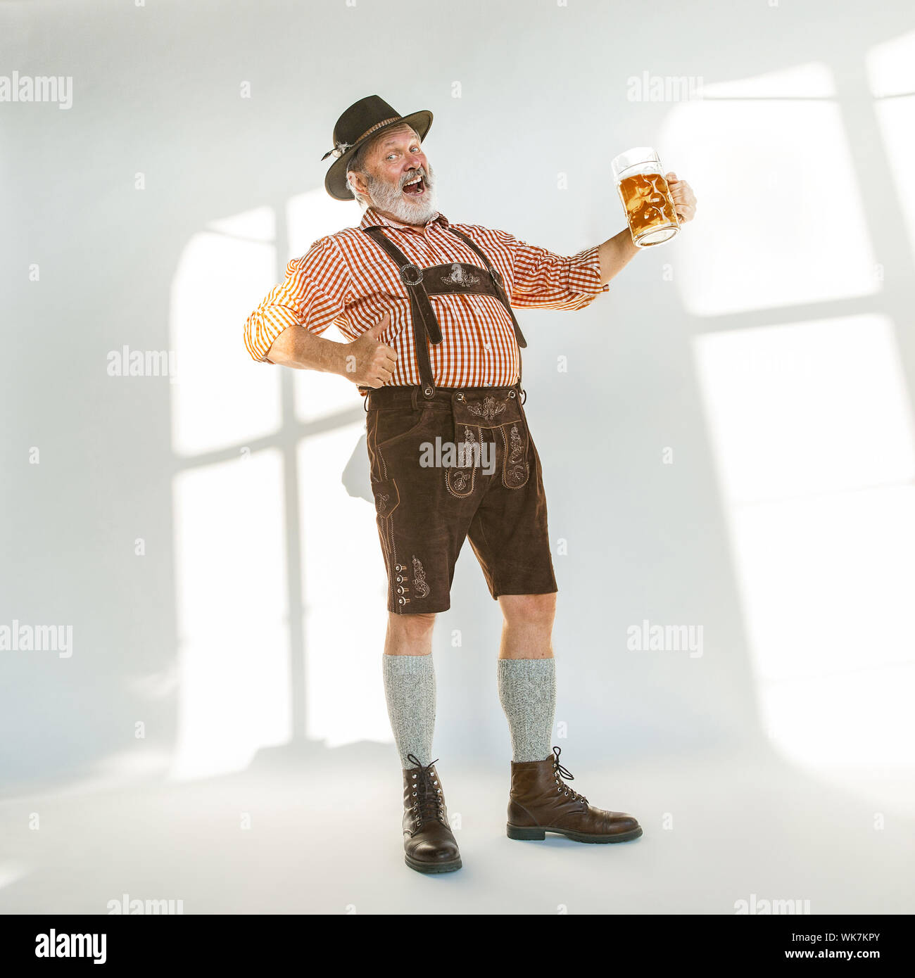 Portrait of Oktoberfest senior man in hat, wearing the traditional ...