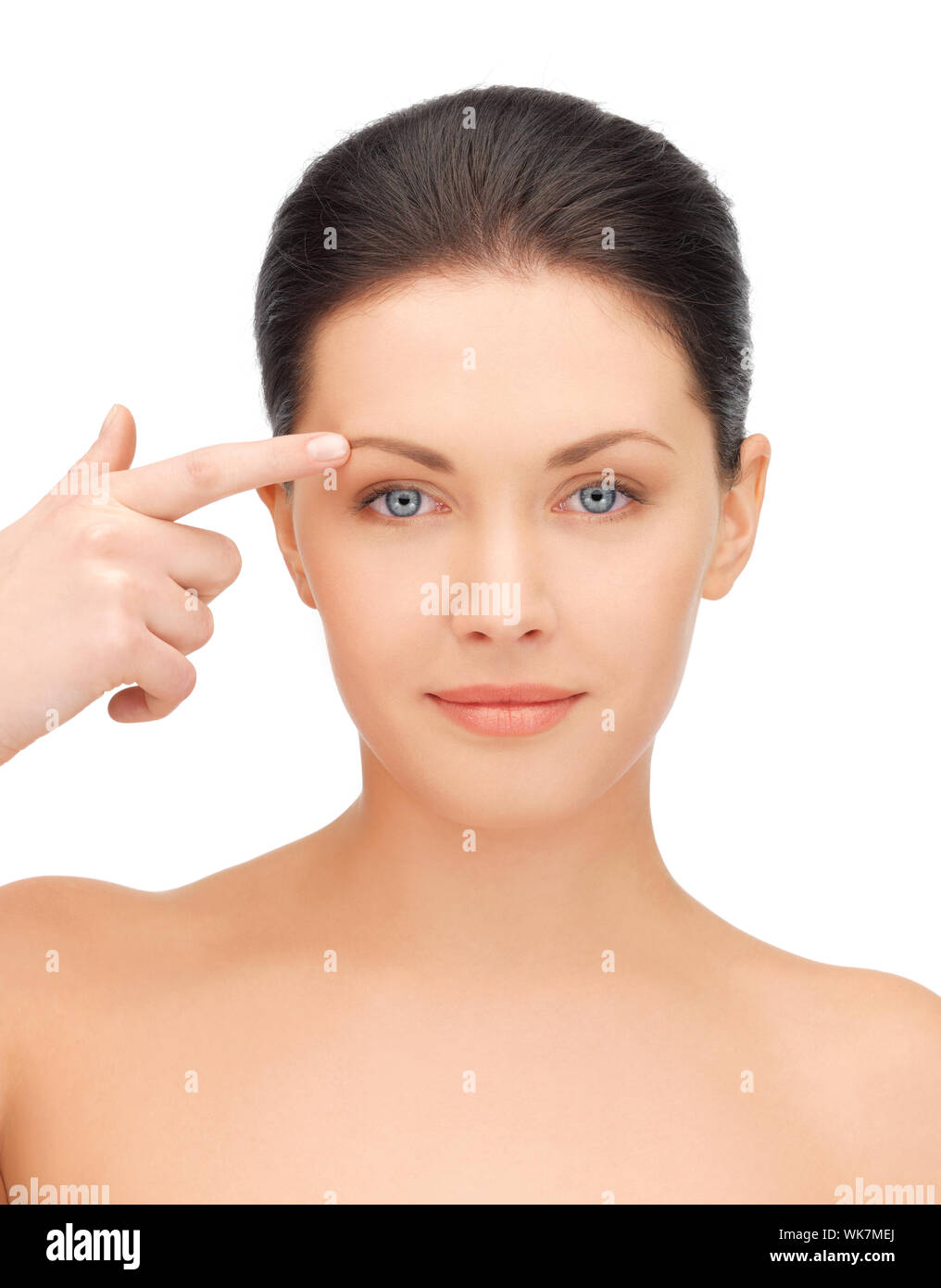 picture of beautiful woman pointing to forehead Stock Photo - Alamy