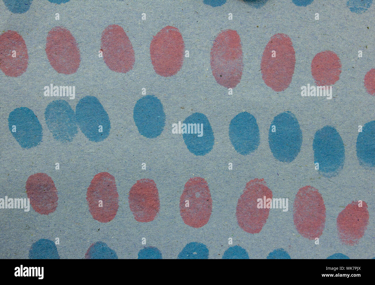 Red and blue finger prints on a color paper Stock Photo - Alamy