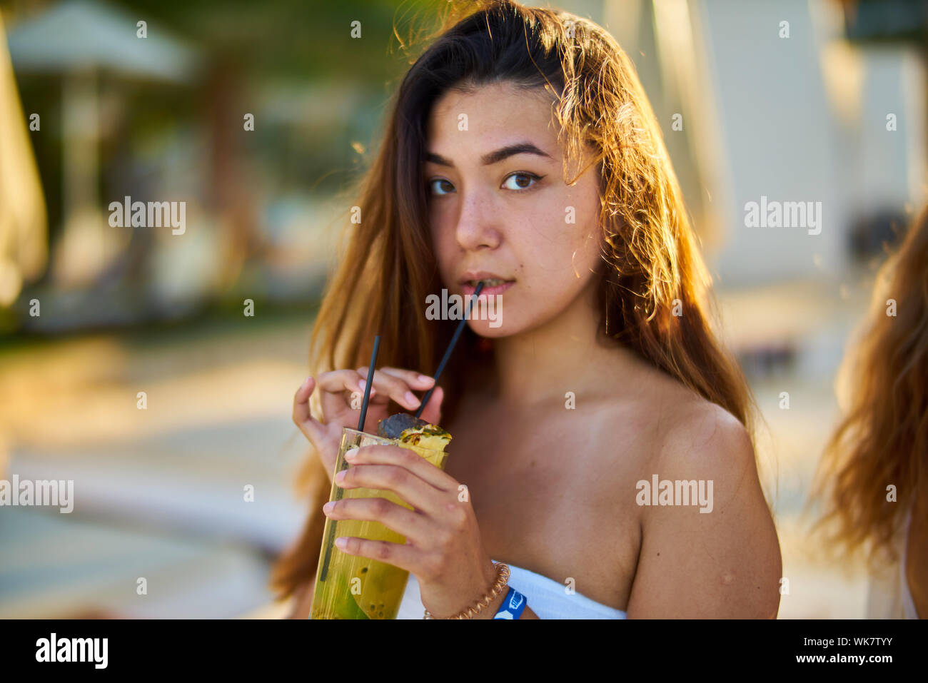 Woman straw hi-res stock photography and images - Alamy