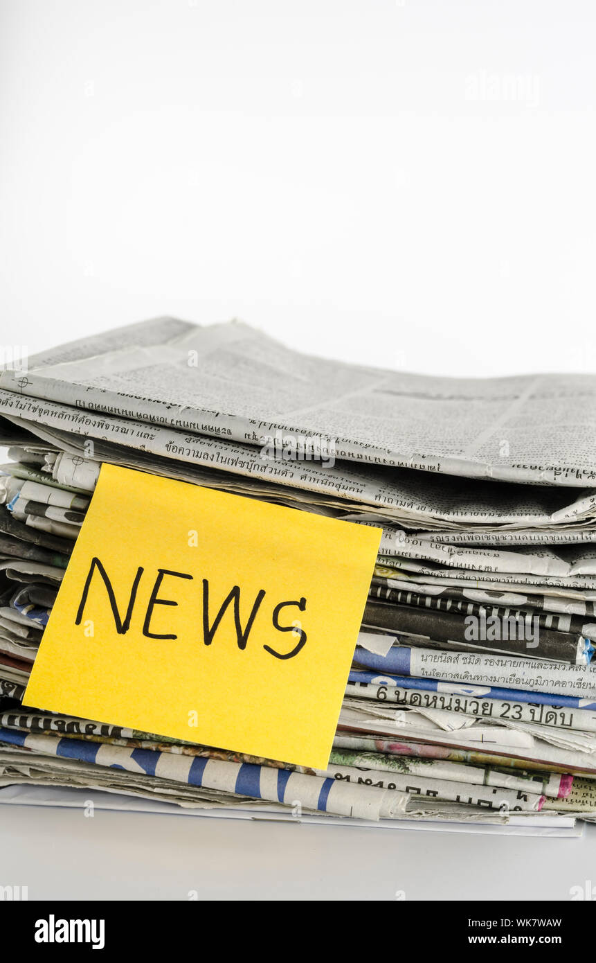 stack of newspaper with post it write news word Stock Photo - Alamy