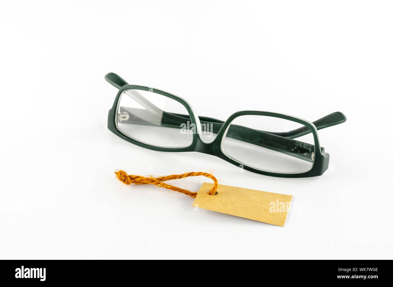 glasses and cost tag on a white background Stock Photo - Alamy