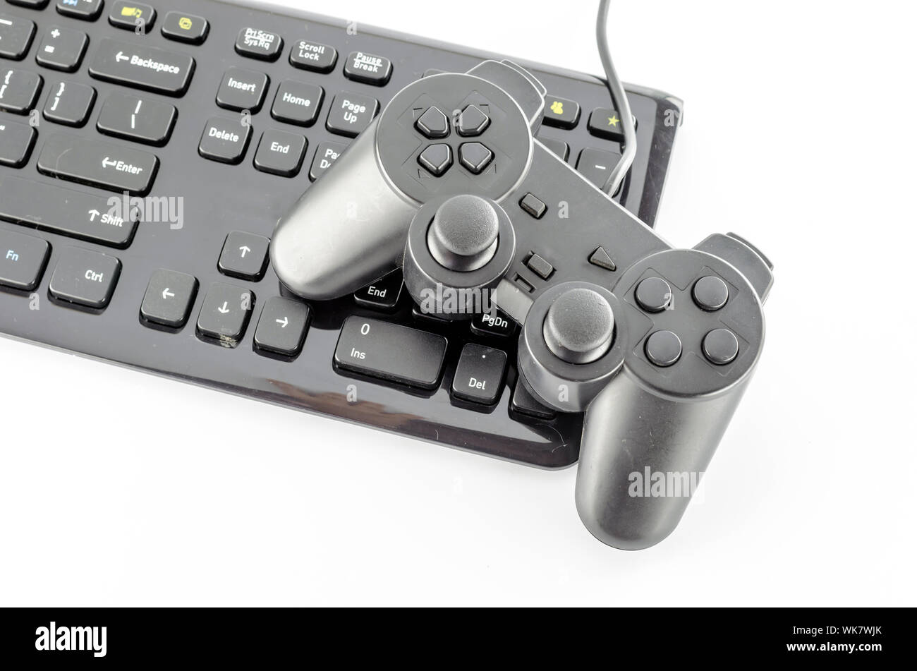 keyboard computer and game controller on a white background Stock Photo ...