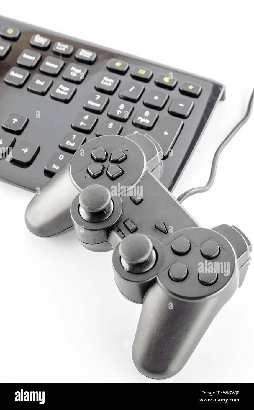 keyboard computer and game controller on a white background Stock Photo ...