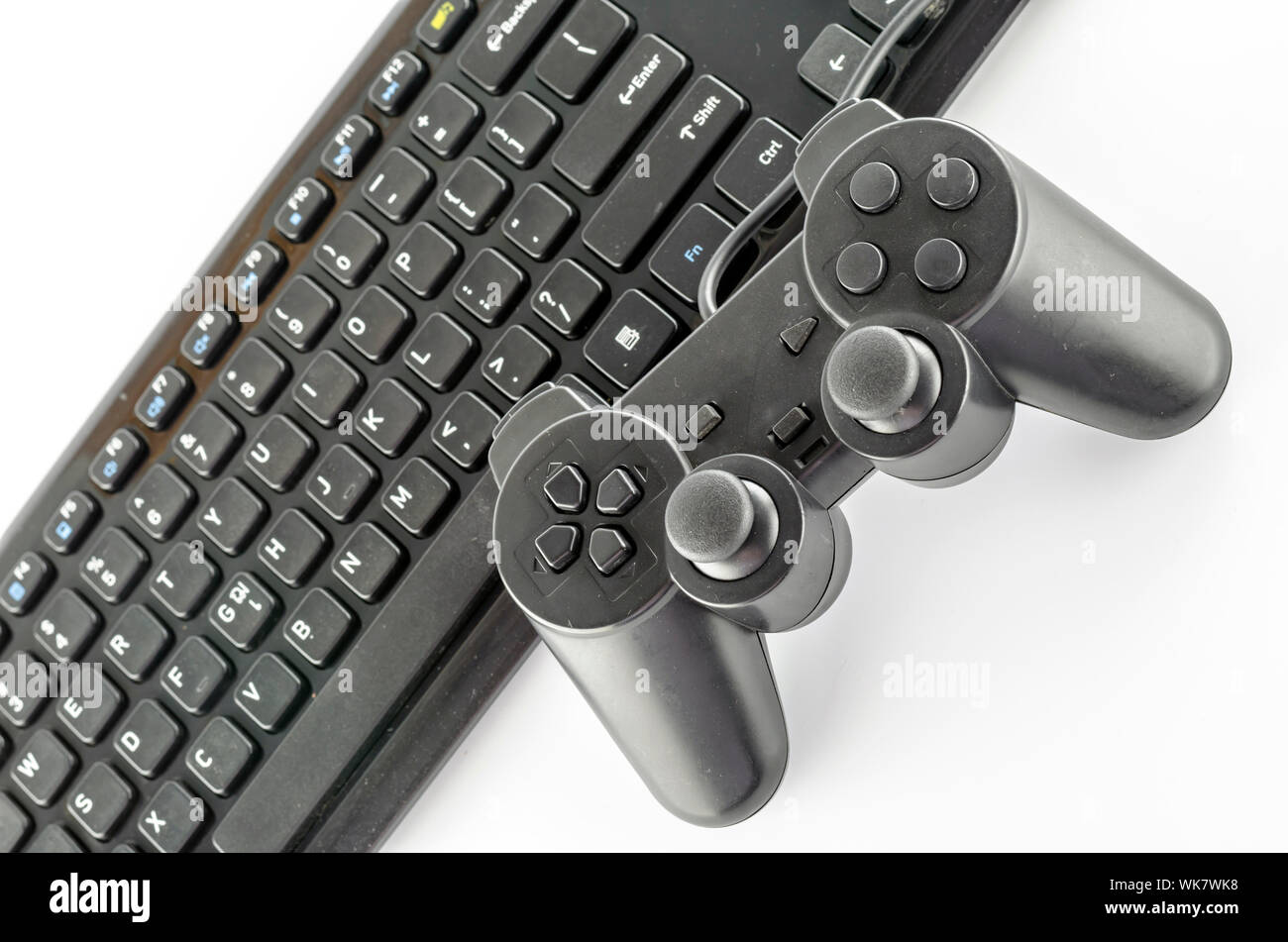 keyboard computer and game controller on a white background Stock Photo ...