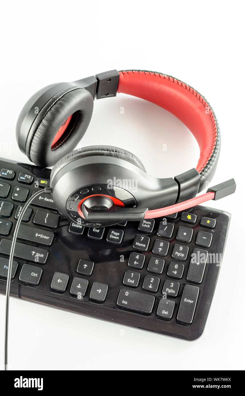 keyboard computer and headphone on a white background Stock Photo - Alamy