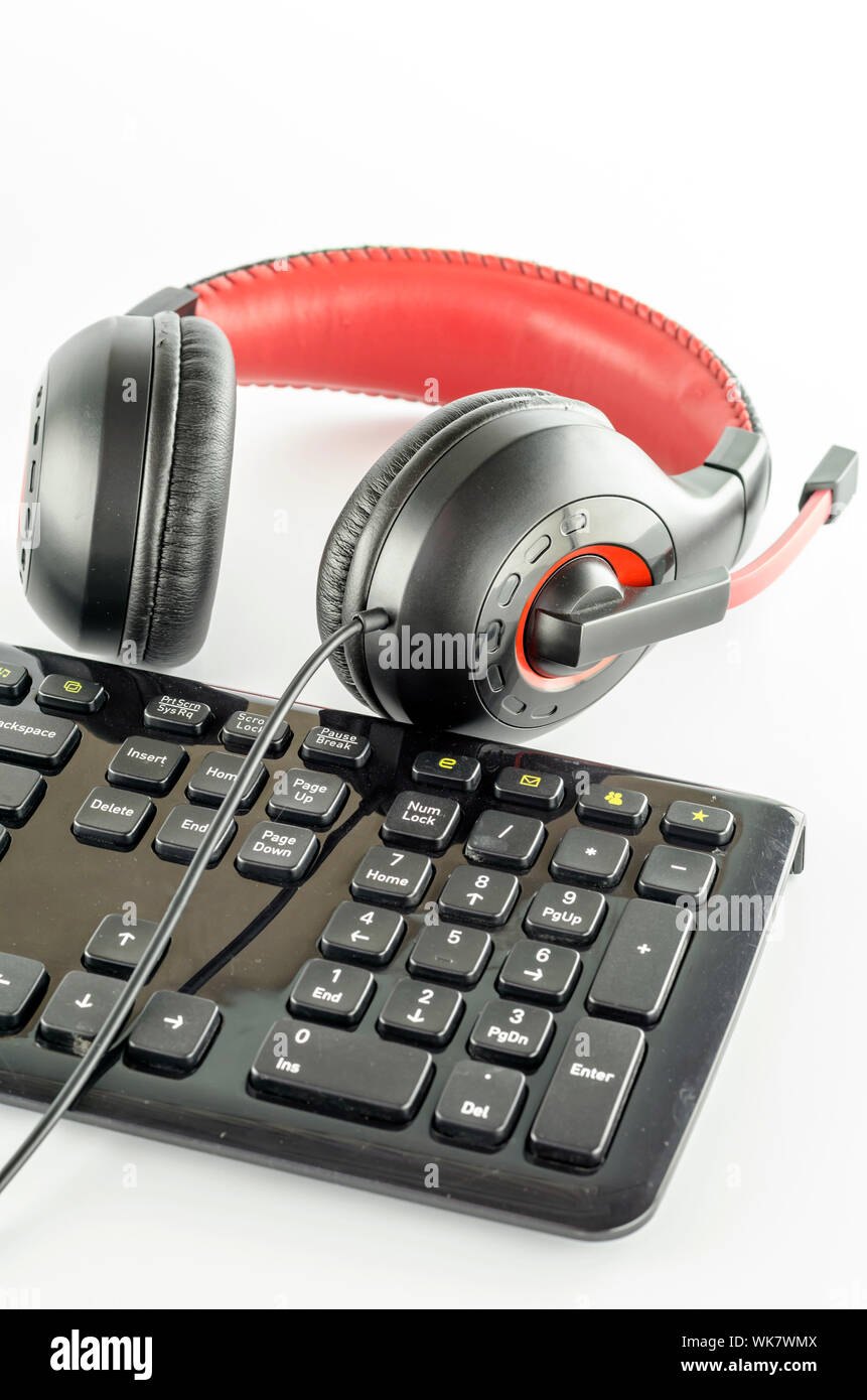 keyboard computer and headphone on a white background Stock Photo - Alamy