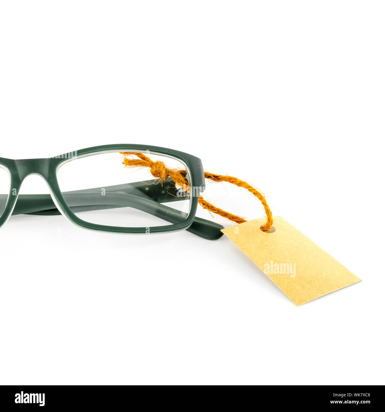 glasses and cost tag on a white background Stock Photo - Alamy