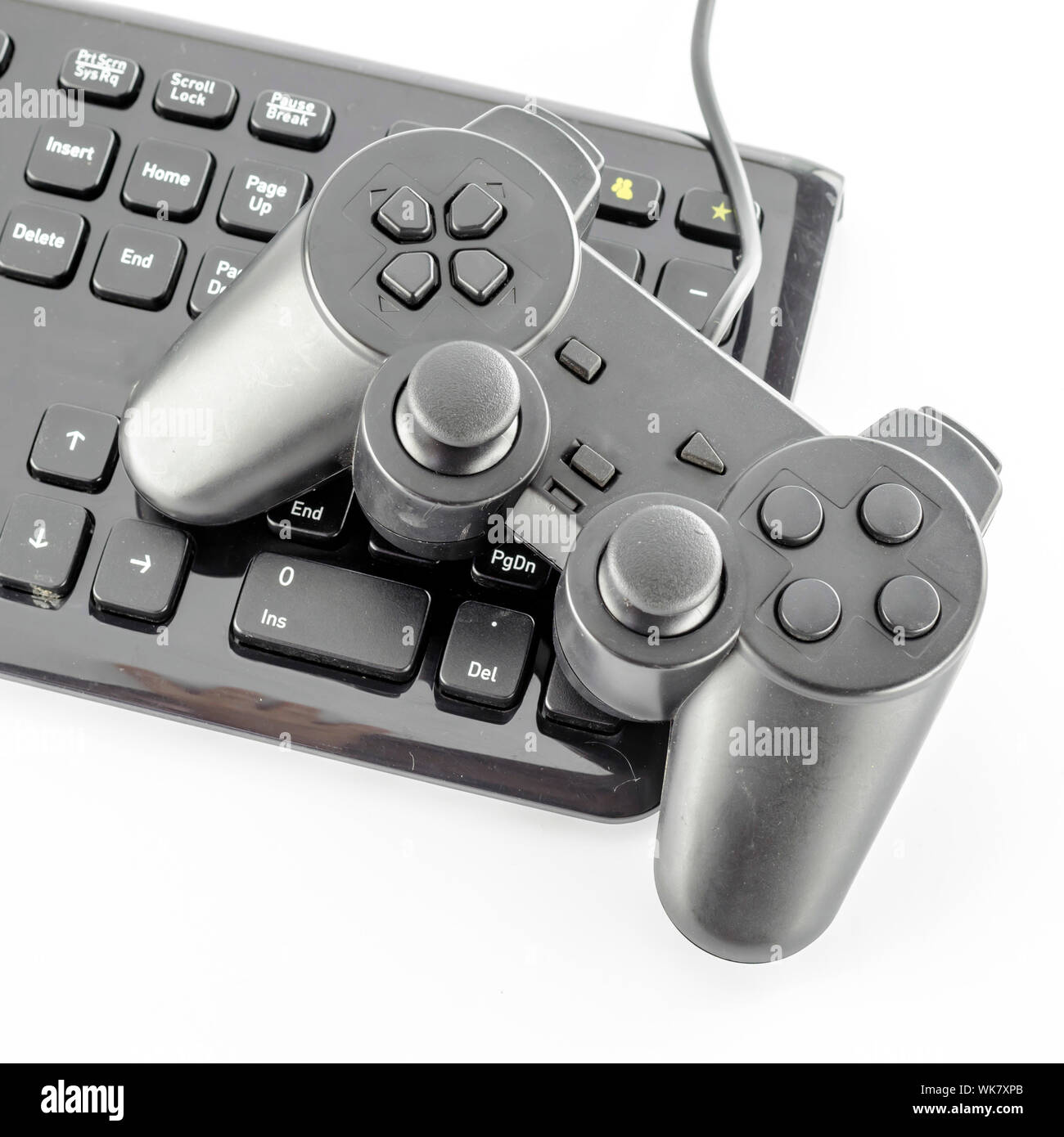keyboard computer and game controller on a white background Stock Photo ...