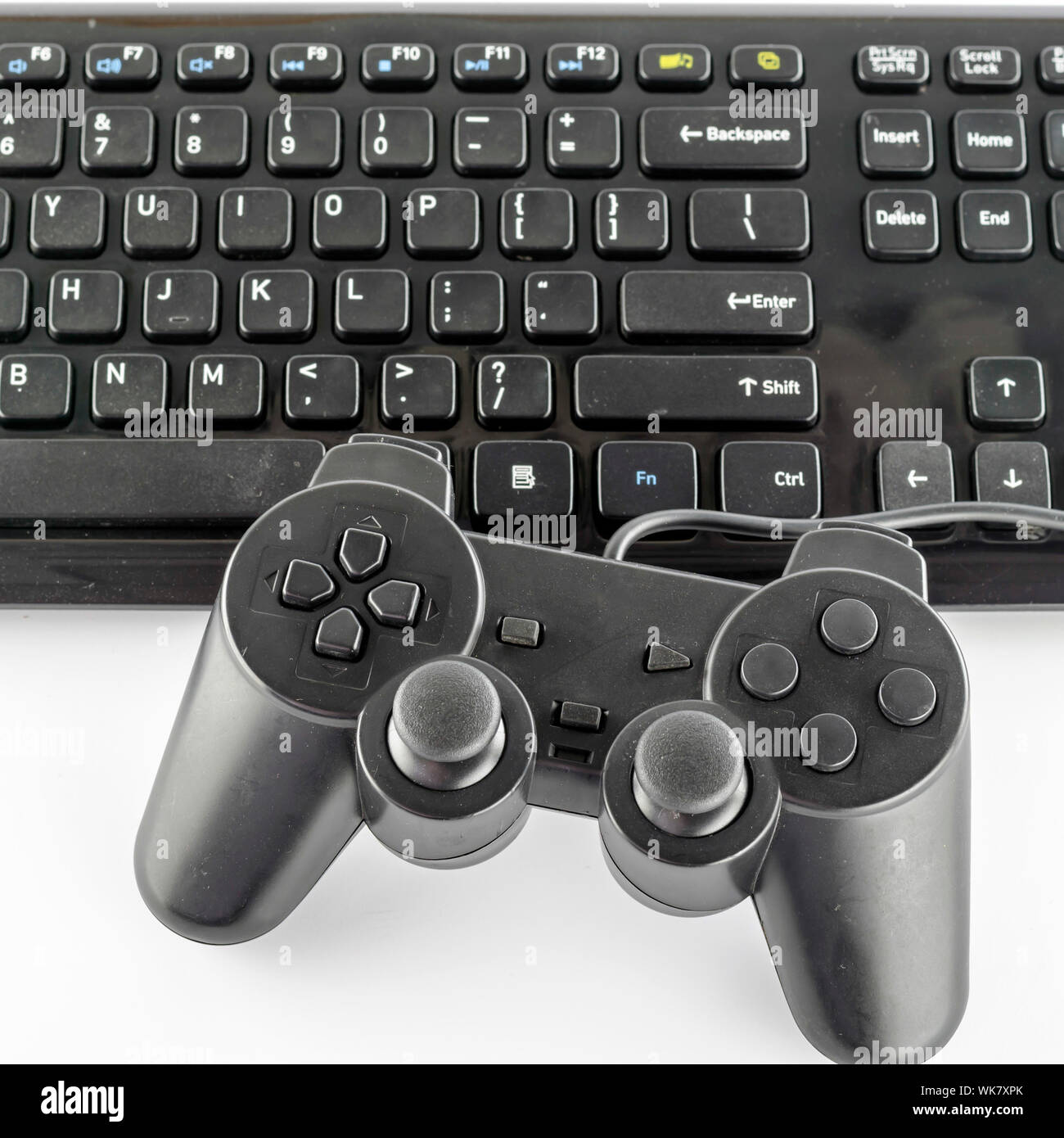 keyboard computer and game controller on a white background Stock Photo ...
