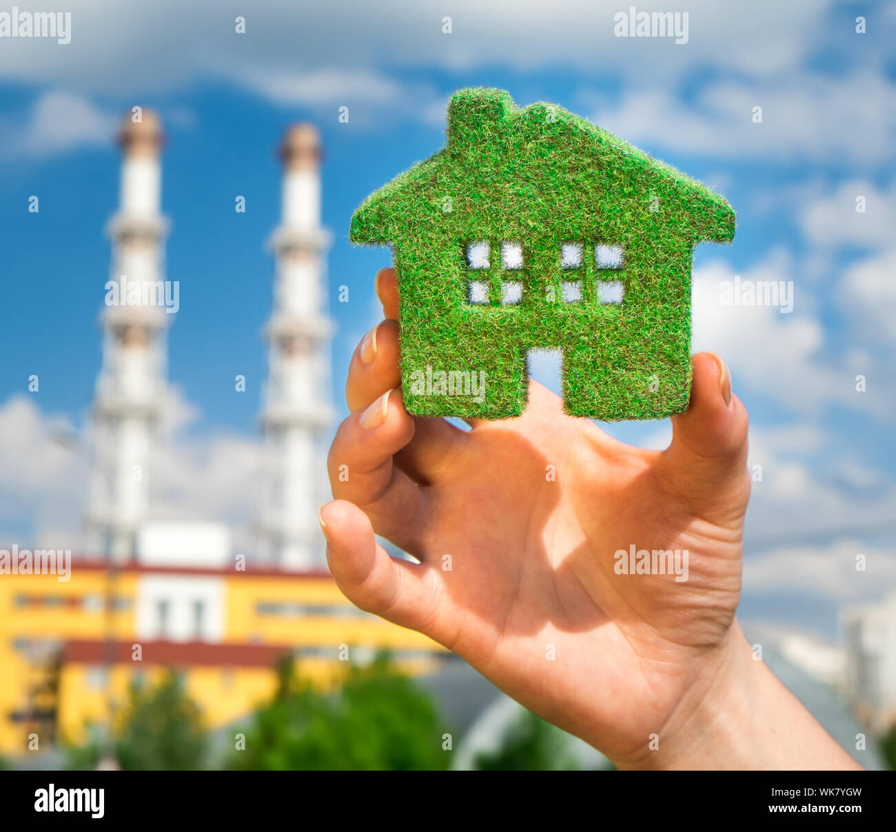 Grass home on a background of blue sky in human hands Stock Photo - Alamy