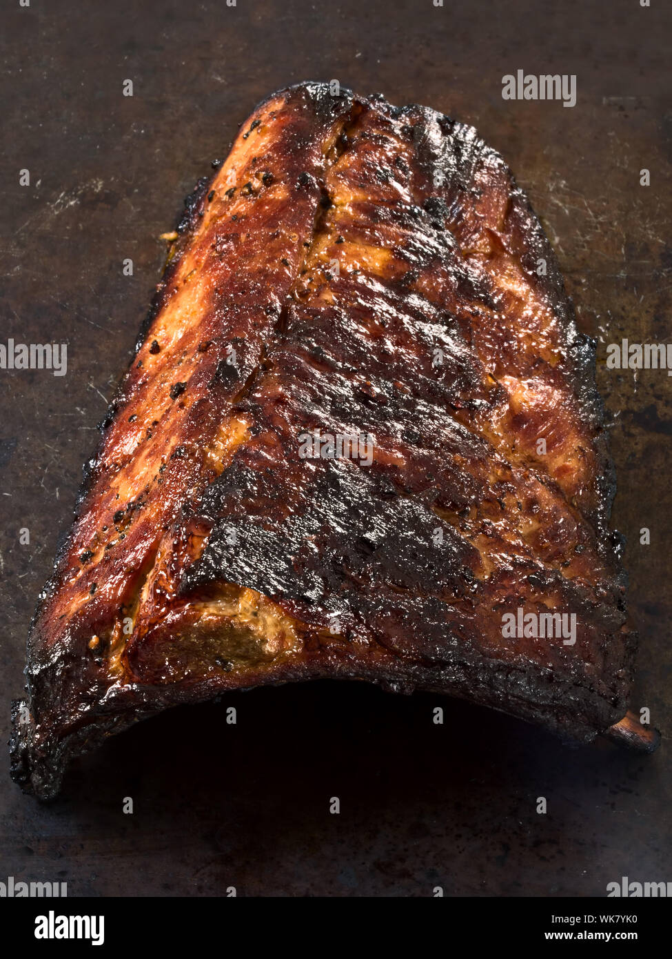 close up of a slab of rustic barbecued pork ribs Stock Photo - Alamy