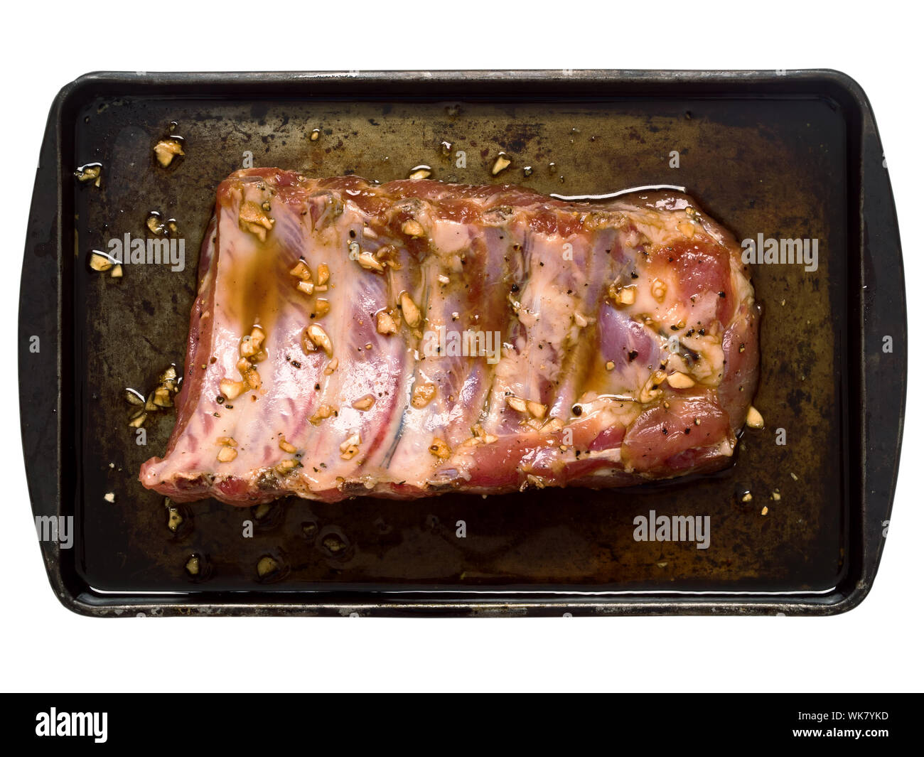 close up of a slab of rustic raw uncooked marinated pork ribs Stock ...