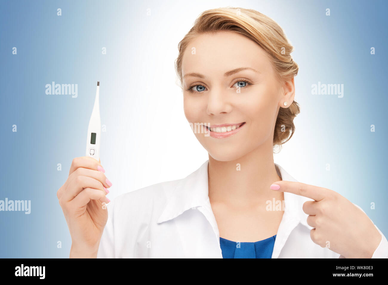 attractive female doctor with thermometer Stock Photo - Alamy