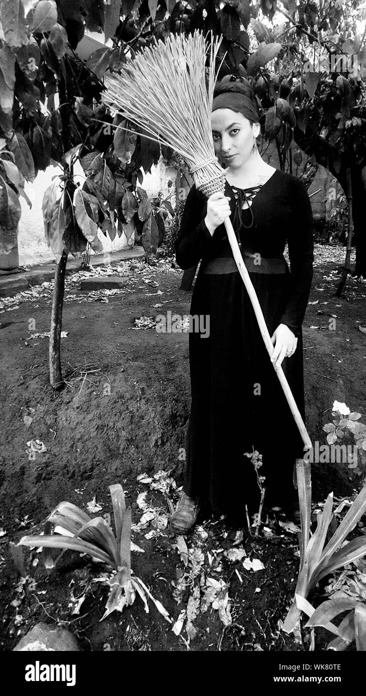 Holding Broom High Resolution Stock Photography and Images - Alamy