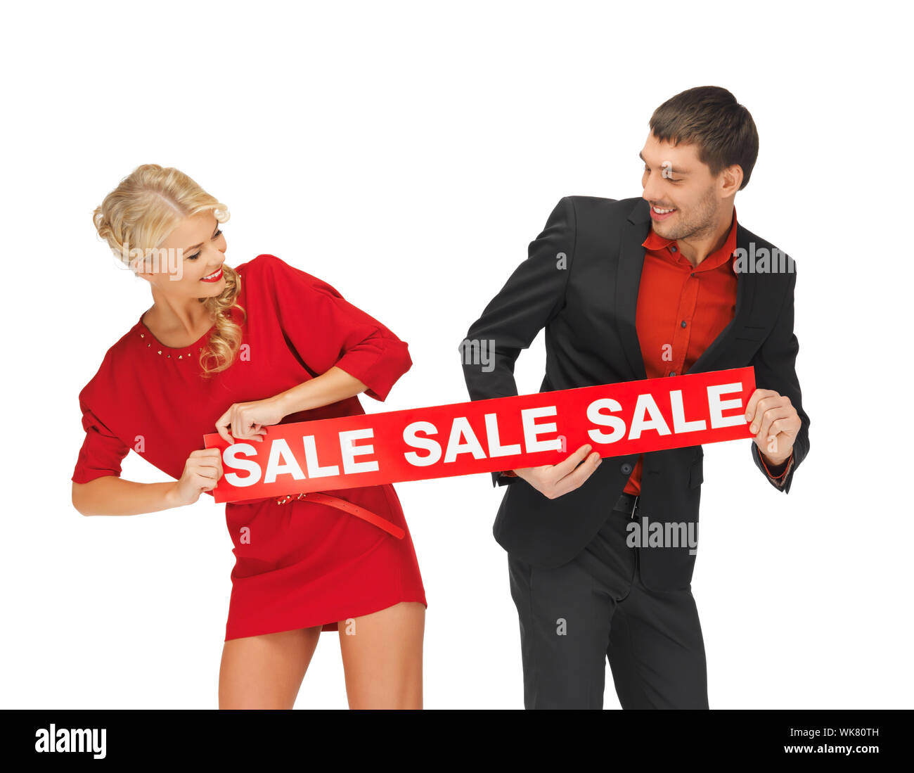 Woman holding sale sign smiling Cut Out Stock Images & Pictures - Alamy