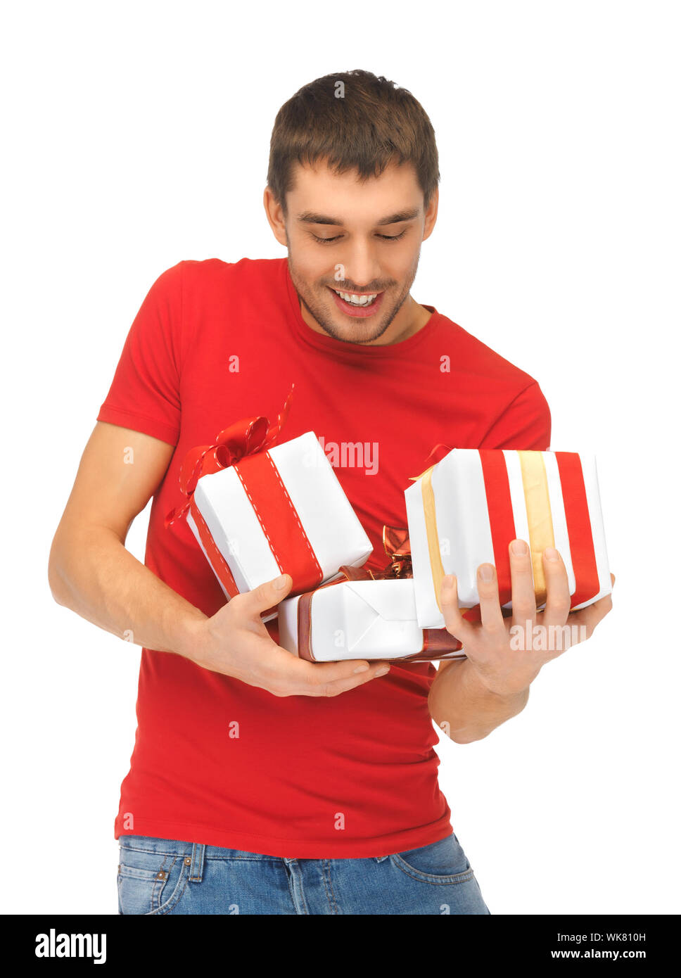 bright picture of handsome man holding many gift boxes Stock Photo - Alamy