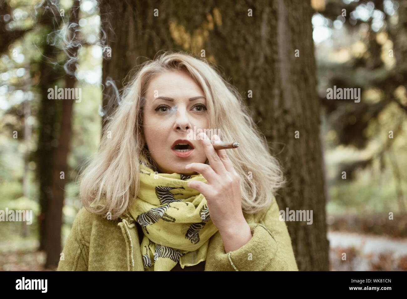 Young woman smoking cigar addiction hi-res stock photography and images ...