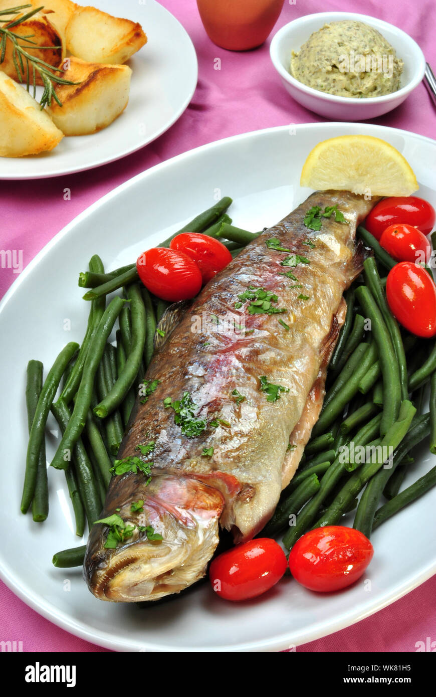 grilled rainbow trout with organic green beans Stock Photo - Alamy